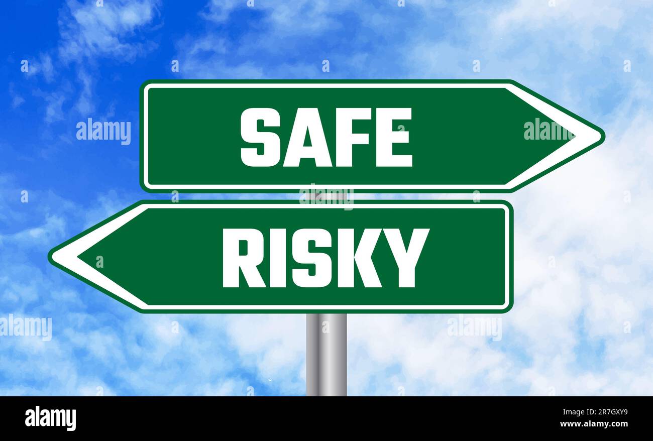 Safe or risky road sign on cloudy sky background Stock Photo - Alamy