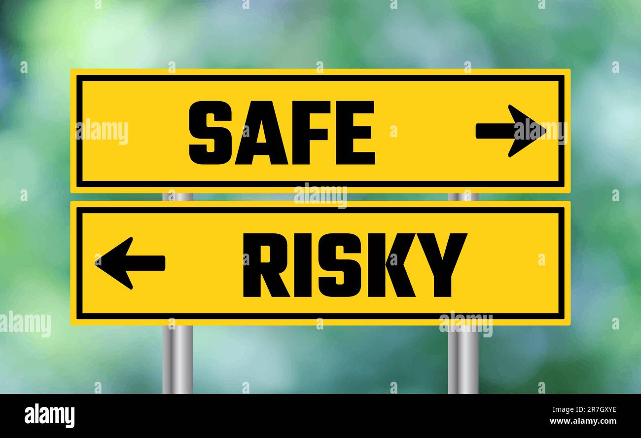 Safe or risky road sign on blur background Stock Photo - Alamy