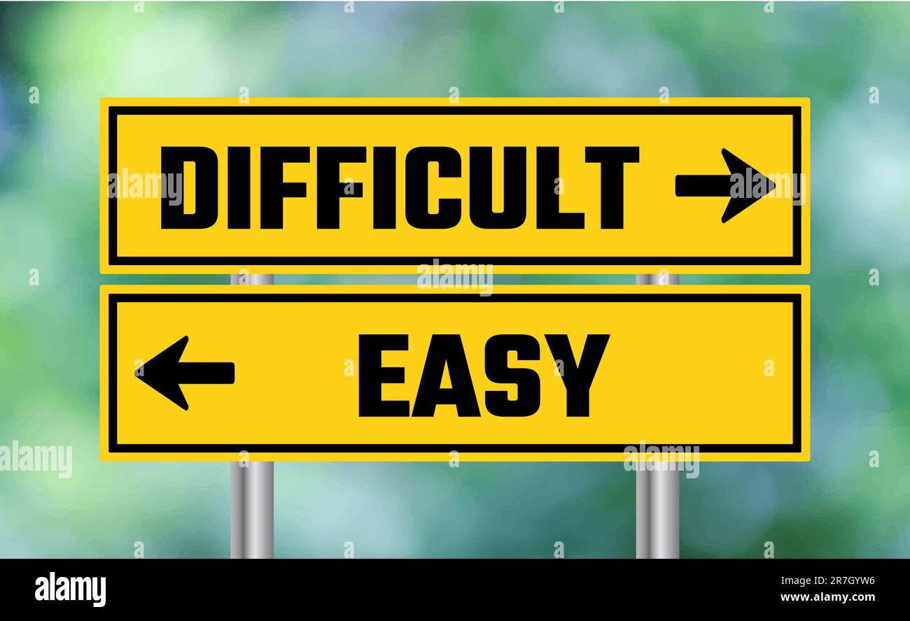 Difficult or easy road sign on blur background Stock Photo - Alamy