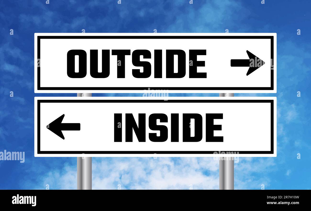 Outside or inside road sign on blue sky background Stock Photo - Alamy