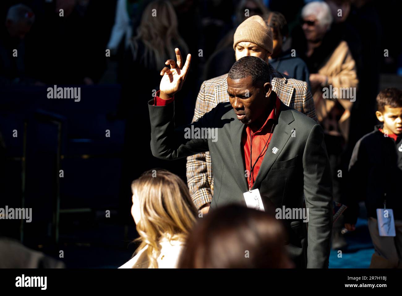 Michael Finley waves to fans as he walks to his seat prior to the start ...