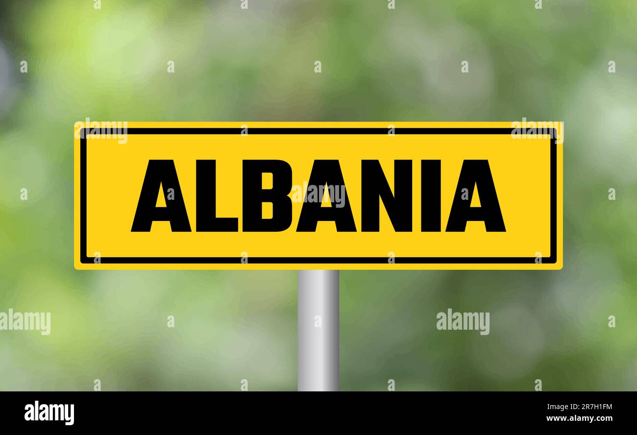 Albania road sign on blur background Stock Photo - Alamy