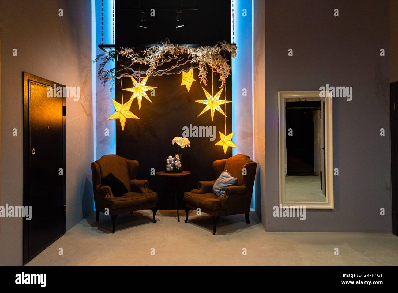 Comfy brown chairs in a cozy interior. Interior of a loft room ...