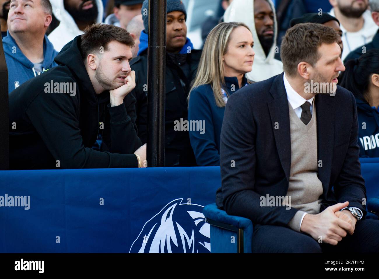 Luka Doncic and Dirk Nowitzki listen to Mark Cuban, not pictured, speak ...