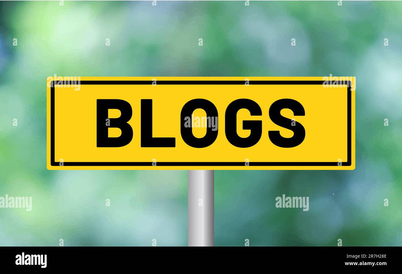Blogs road sign on blur background Stock Photo - Alamy