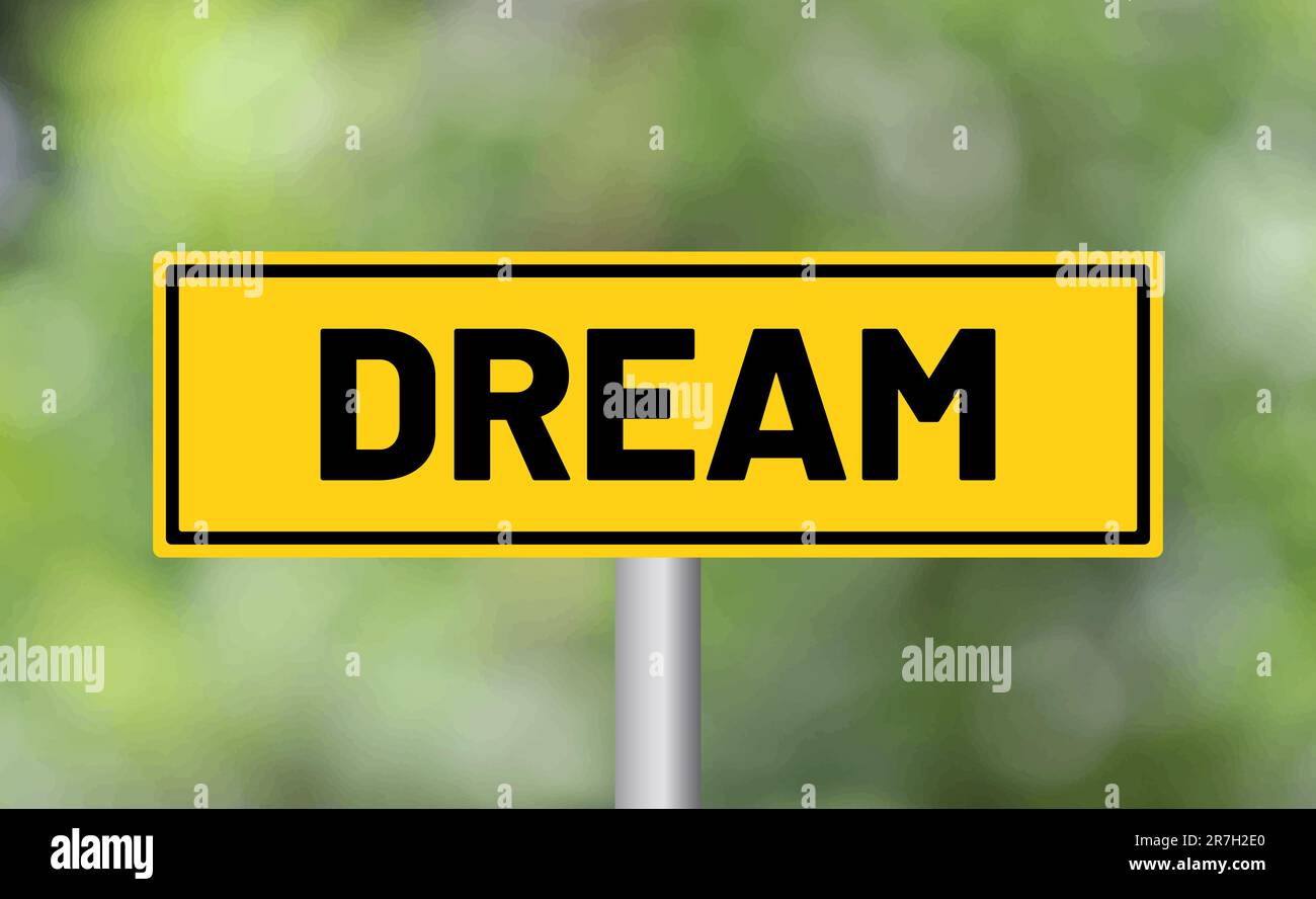 Dream road sign on blur background Stock Photo - Alamy