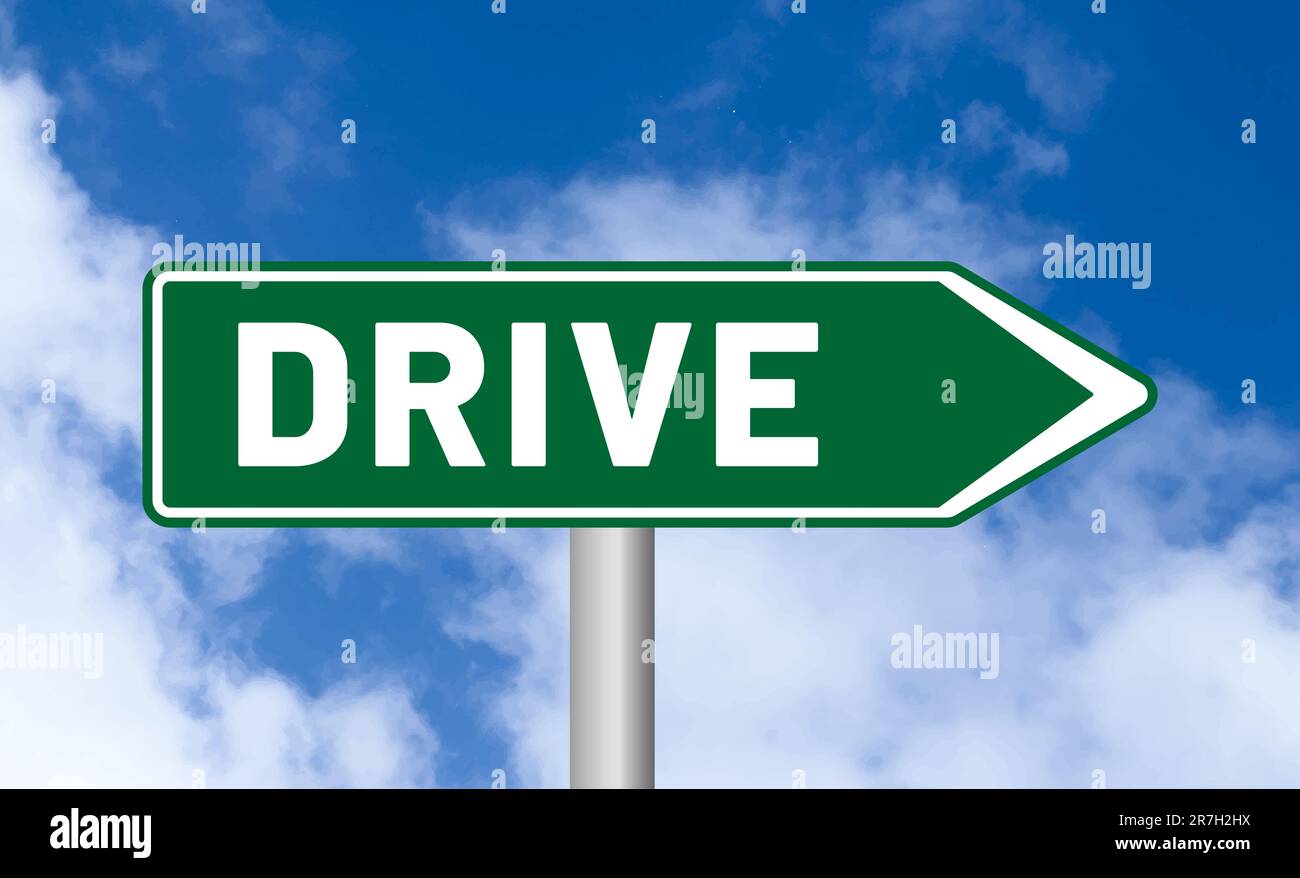 Drive road sign on sky background Stock Photo - Alamy