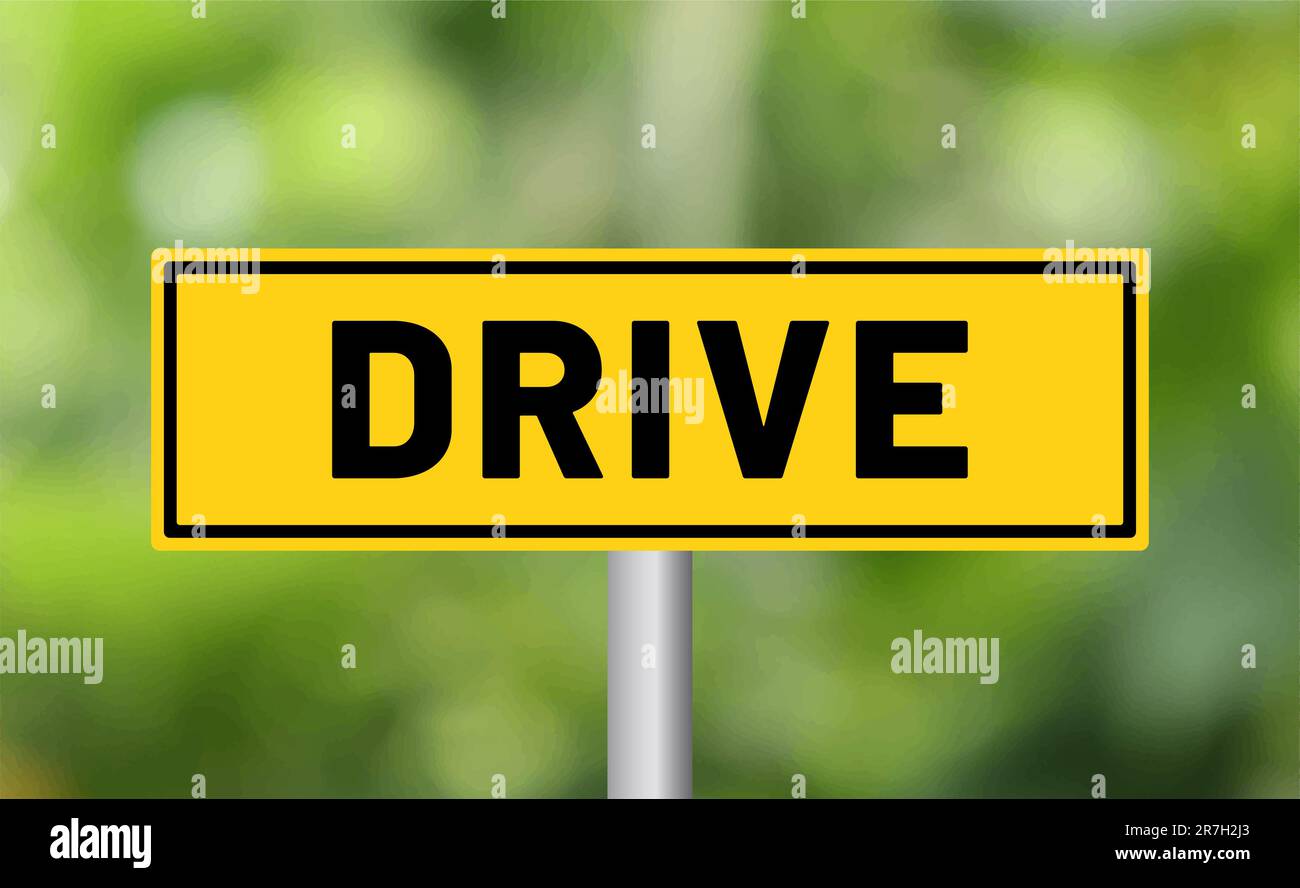 Drive road sign on blur background Stock Photo - Alamy