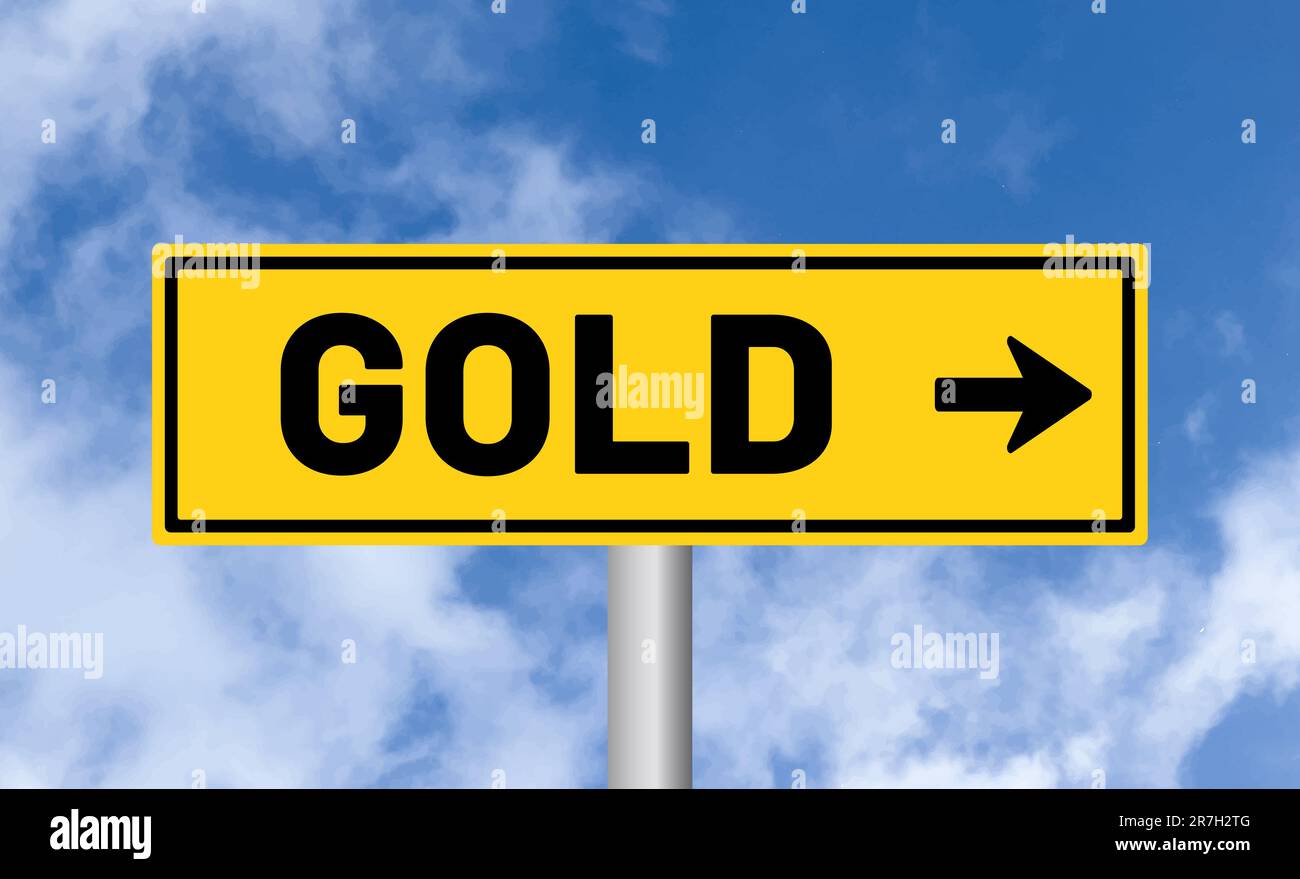 Gold road sign on sky background Stock Photo - Alamy
