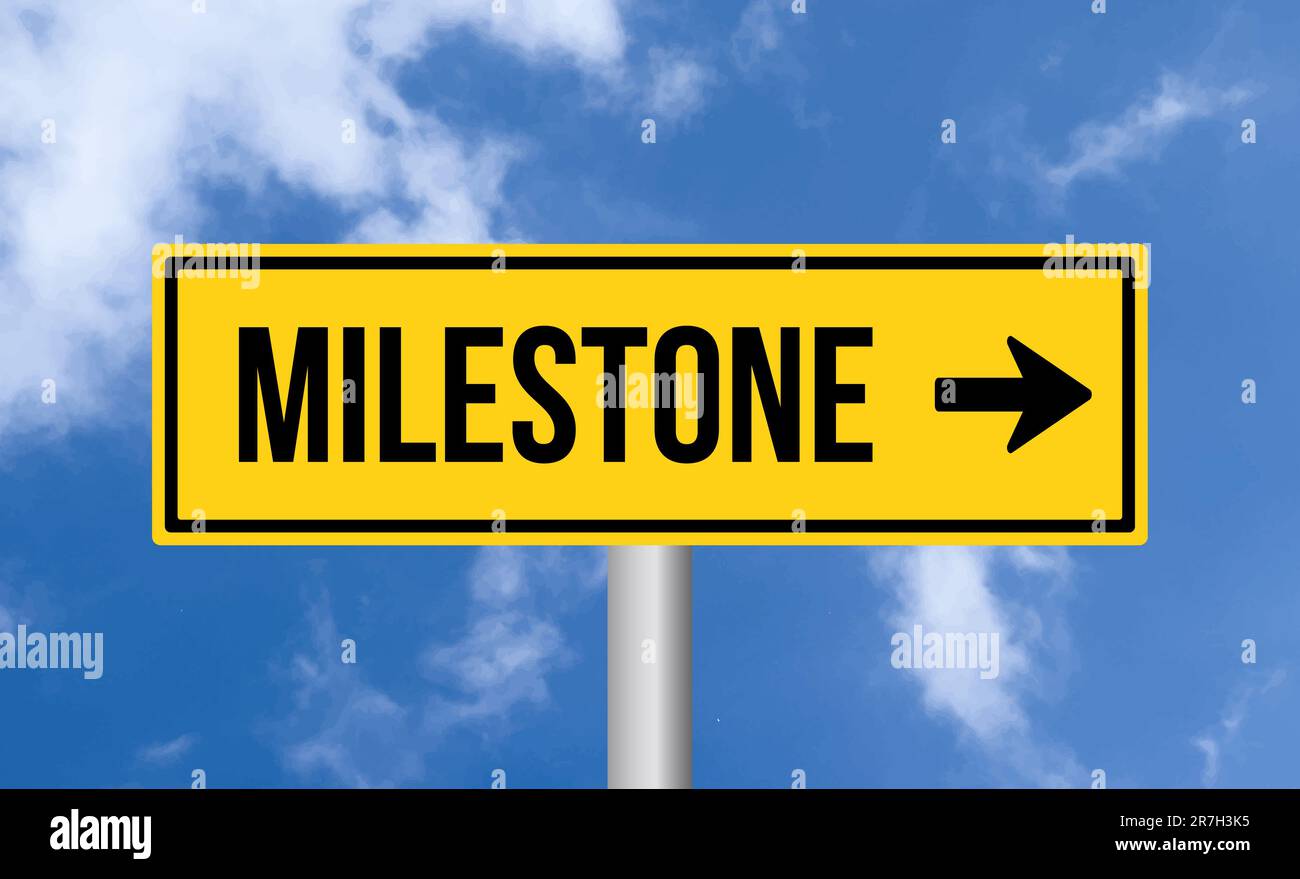 Milestone road sign on sky background Stock Photo - Alamy