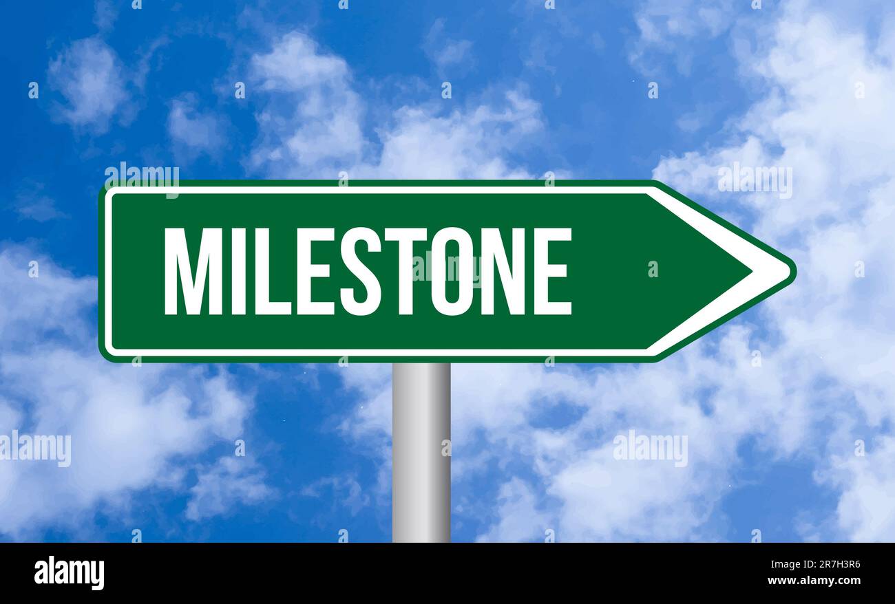 Milestone road sign on sky background Stock Photo - Alamy