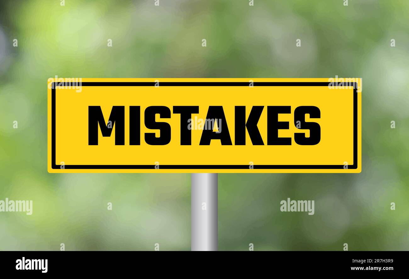 Mistakes road sign on blur background Stock Photo - Alamy