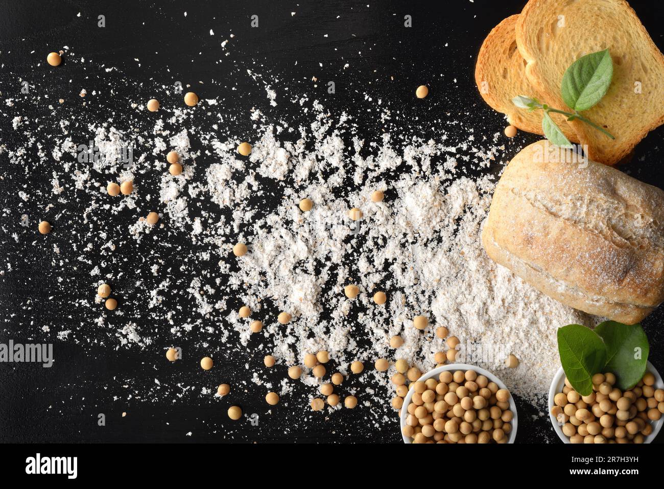 Soybean flour bread, toasted flour on black kitchen bench with ...