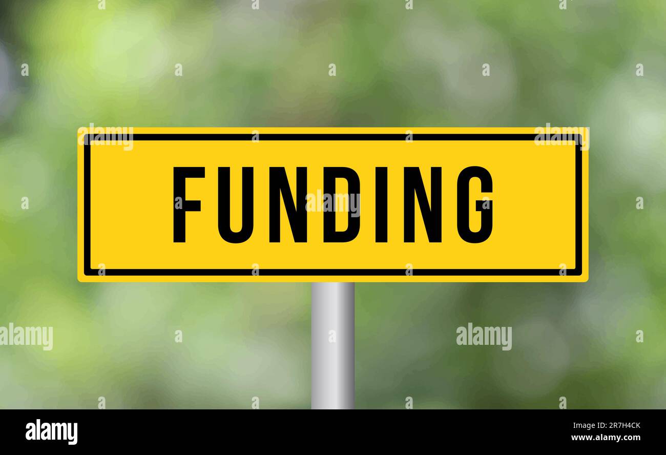 Funding road sign on blur background Stock Photo - Alamy