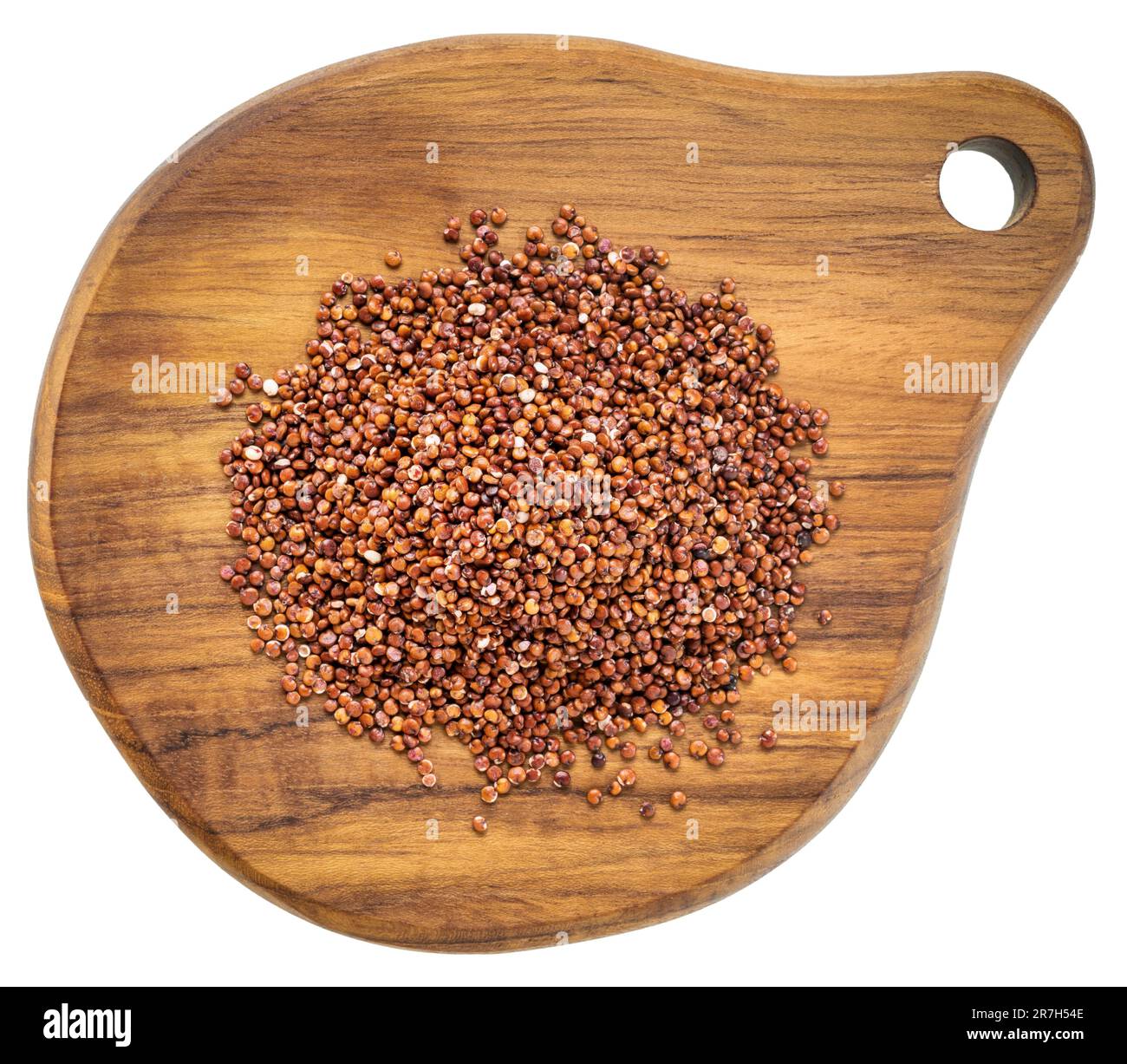gluten free red quinoa grain on a mini wooden cutting board isolated on ...