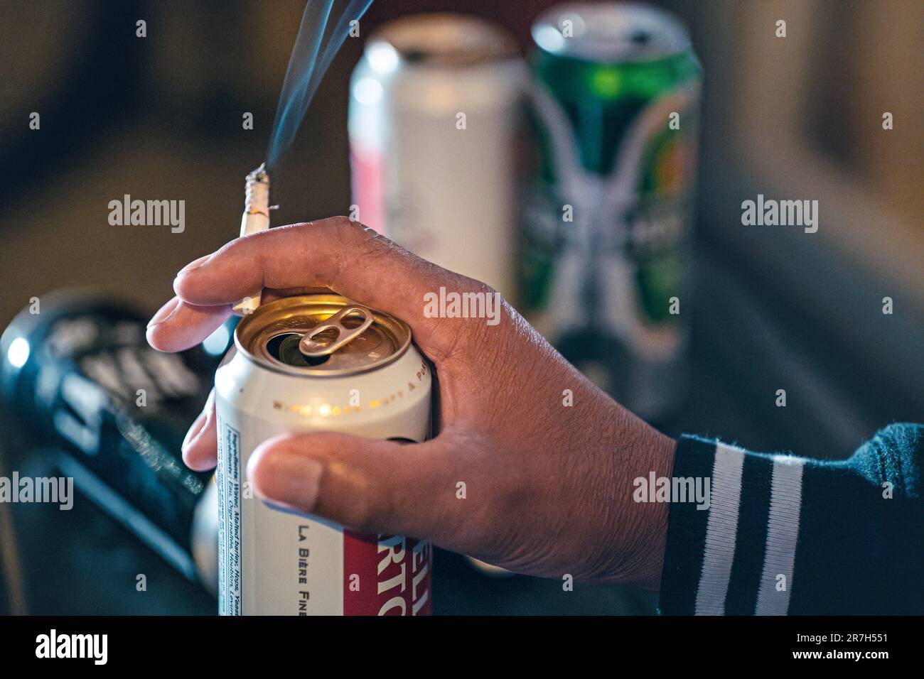 Hand Holding Cigarette and Beer Can Stock Photo - Alamy