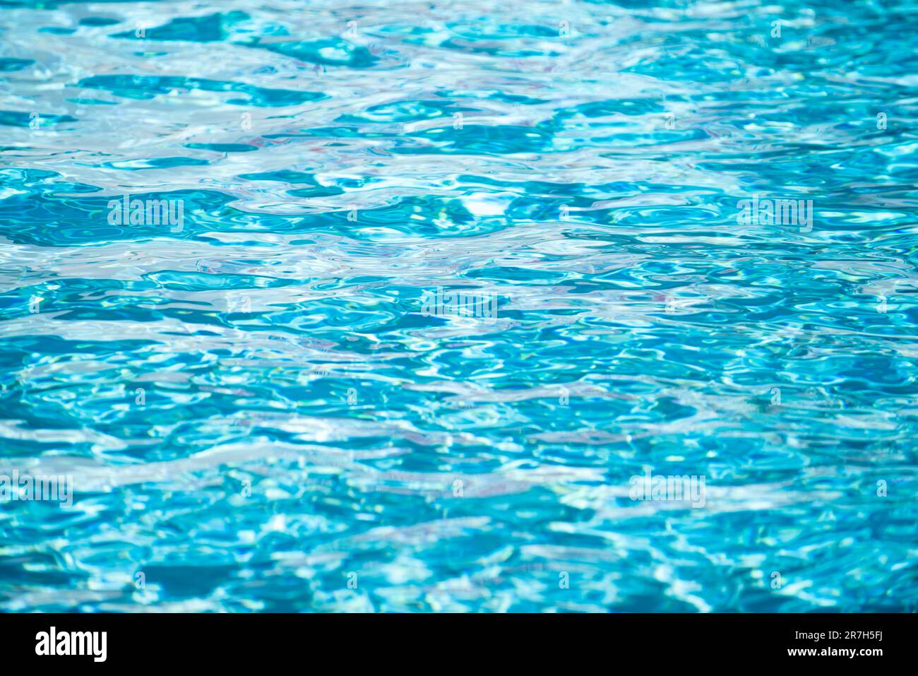 Background of blue water in swimming pool with sun reflection, ripple ...