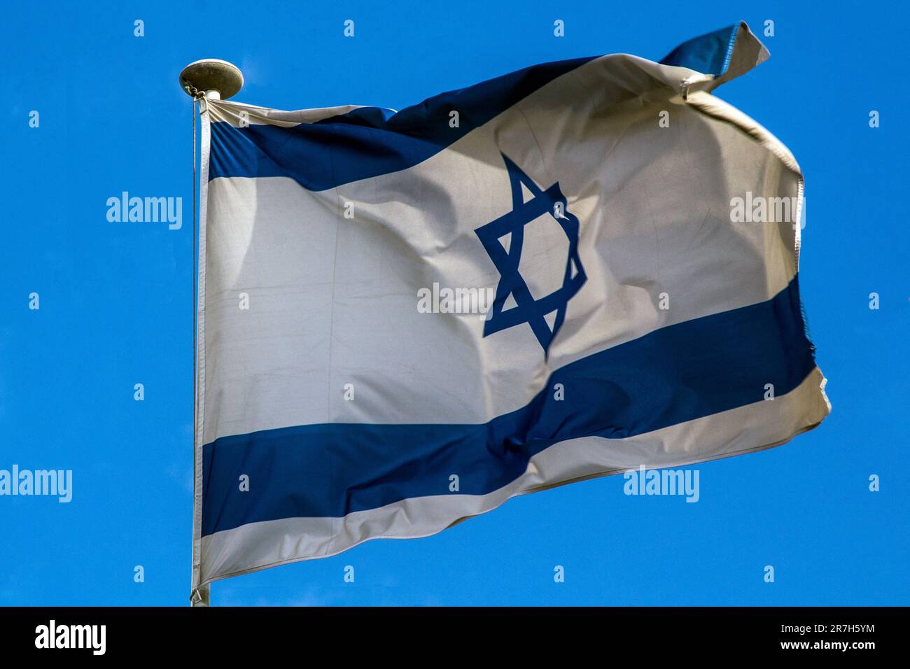 Flag of Israel waving in the wind. With blue sky background Stock Photo ...