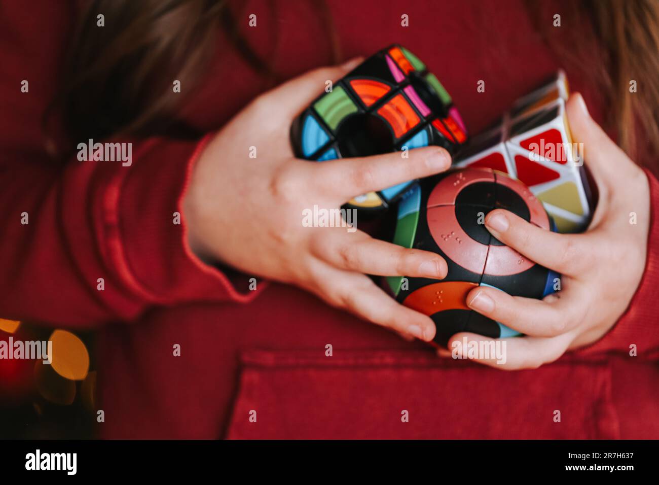 Educational toys. Puzzles of different shapes in hands. Puzzles and ...