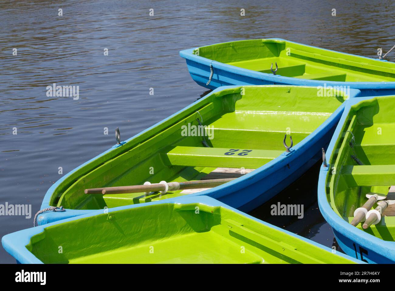 Empty recreational rowing boats on a river Stock Photo - Alamy