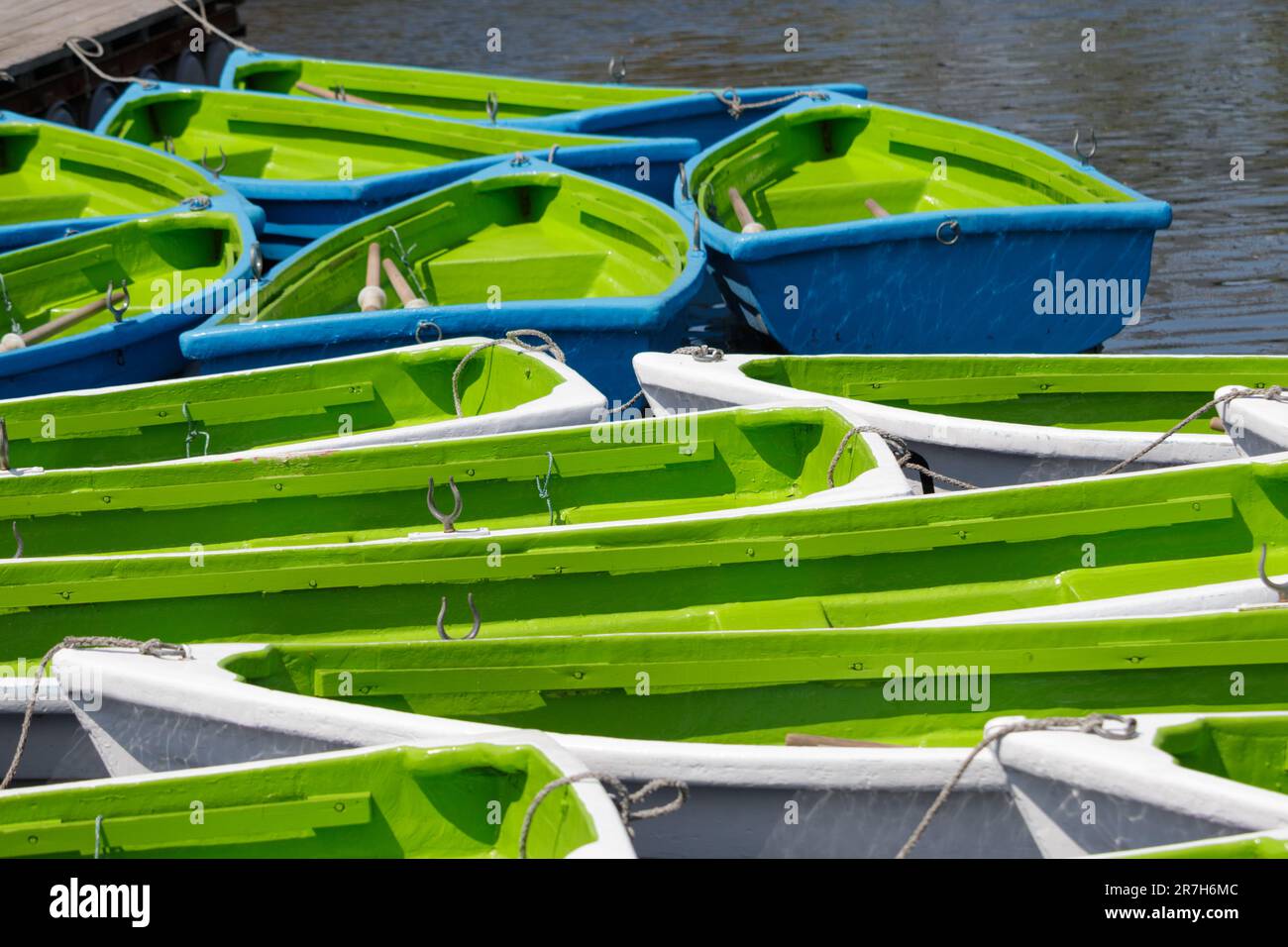 Empty recreational rowing boats on a river Stock Photo - Alamy