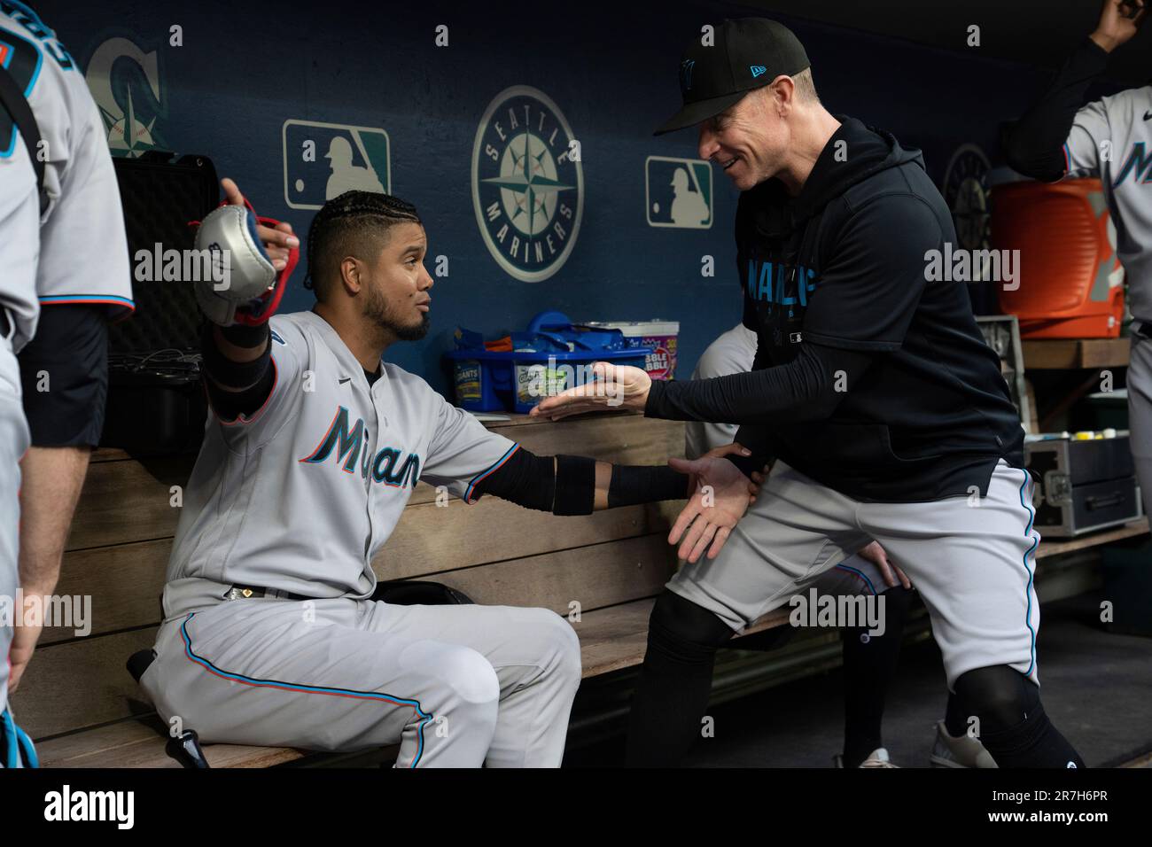Miami Marlins hitting coach Brant Brown, right, greets Luis Arraez in ...