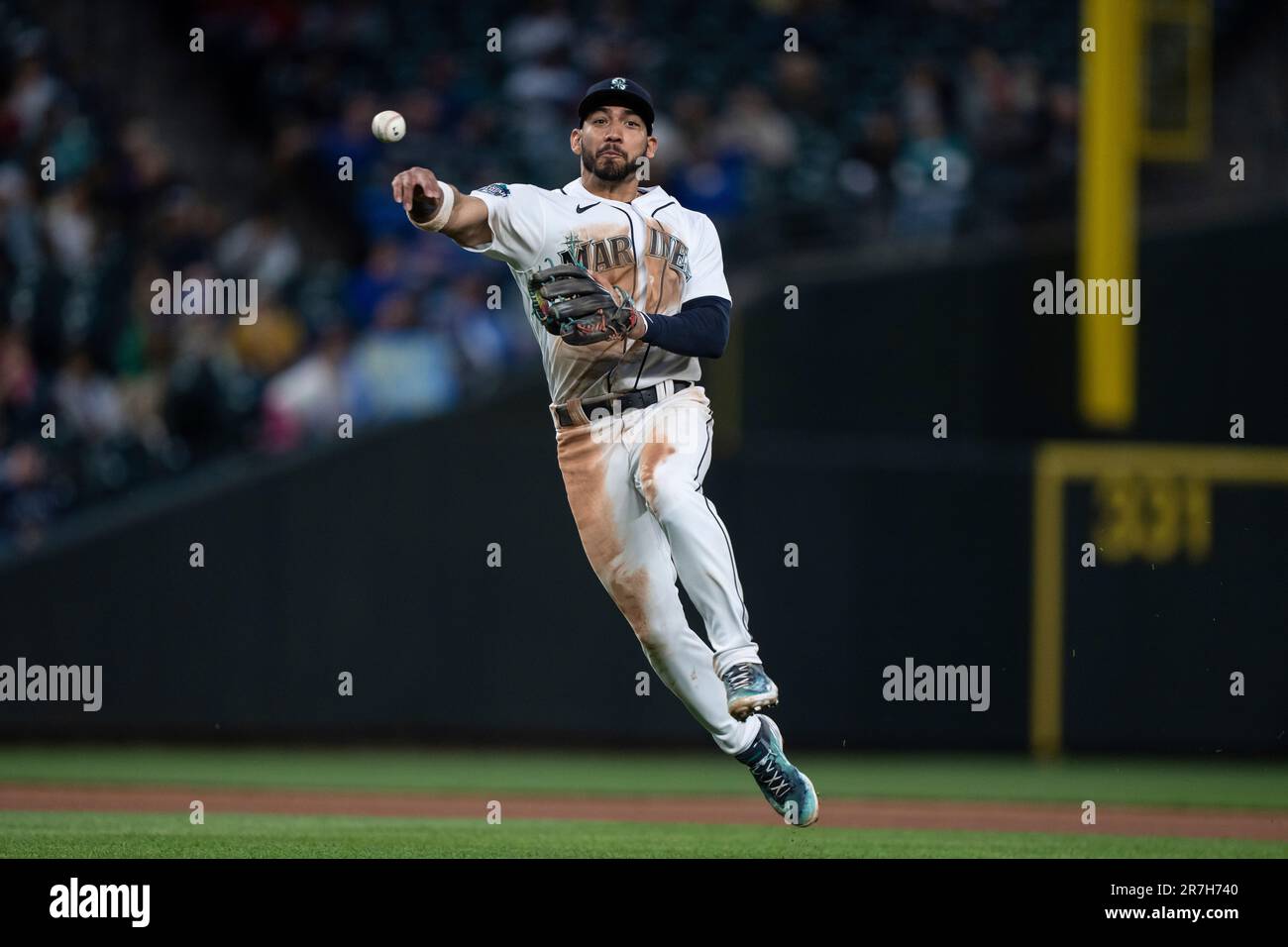 Seattle Mariners second baseman Jose Caballero throws to first base ...