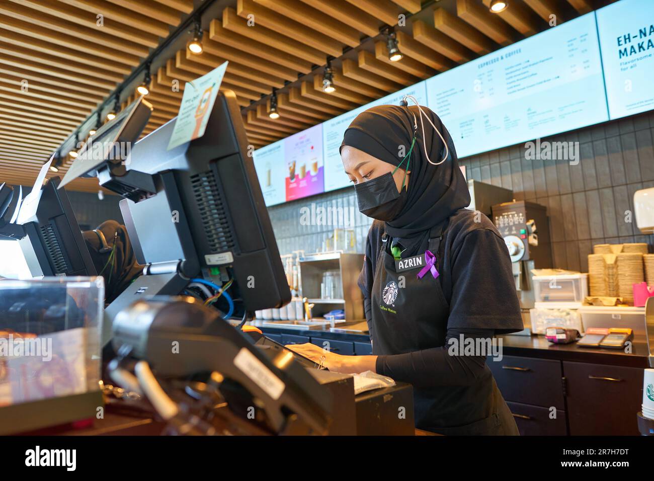 KUALA LUMPUR, MALAYSIA - CIRCA MARCH, 2023: cashier at Starbucks Coffee in Kuala Lumpur Stock ...