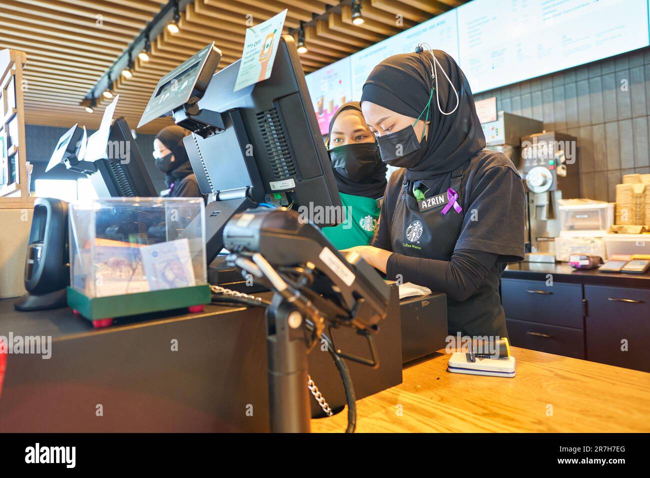 KUALA LUMPUR, MALAYSIA - CIRCA MARCH, 2023: cashier at Starbucks Coffee in Kuala Lumpur Stock ...
