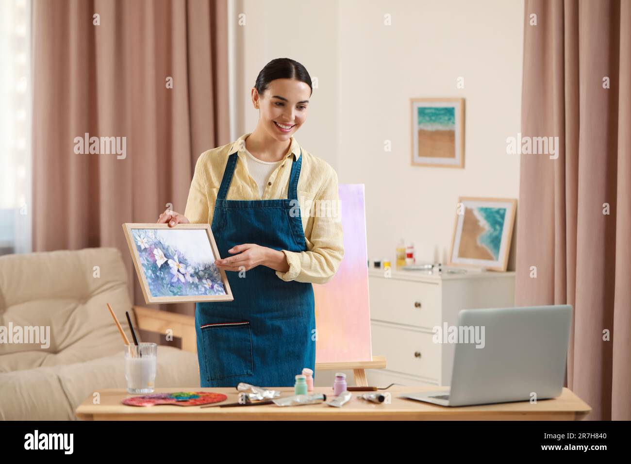 Teacher conducting online painting lesson at home. Time for hobby Stock ...