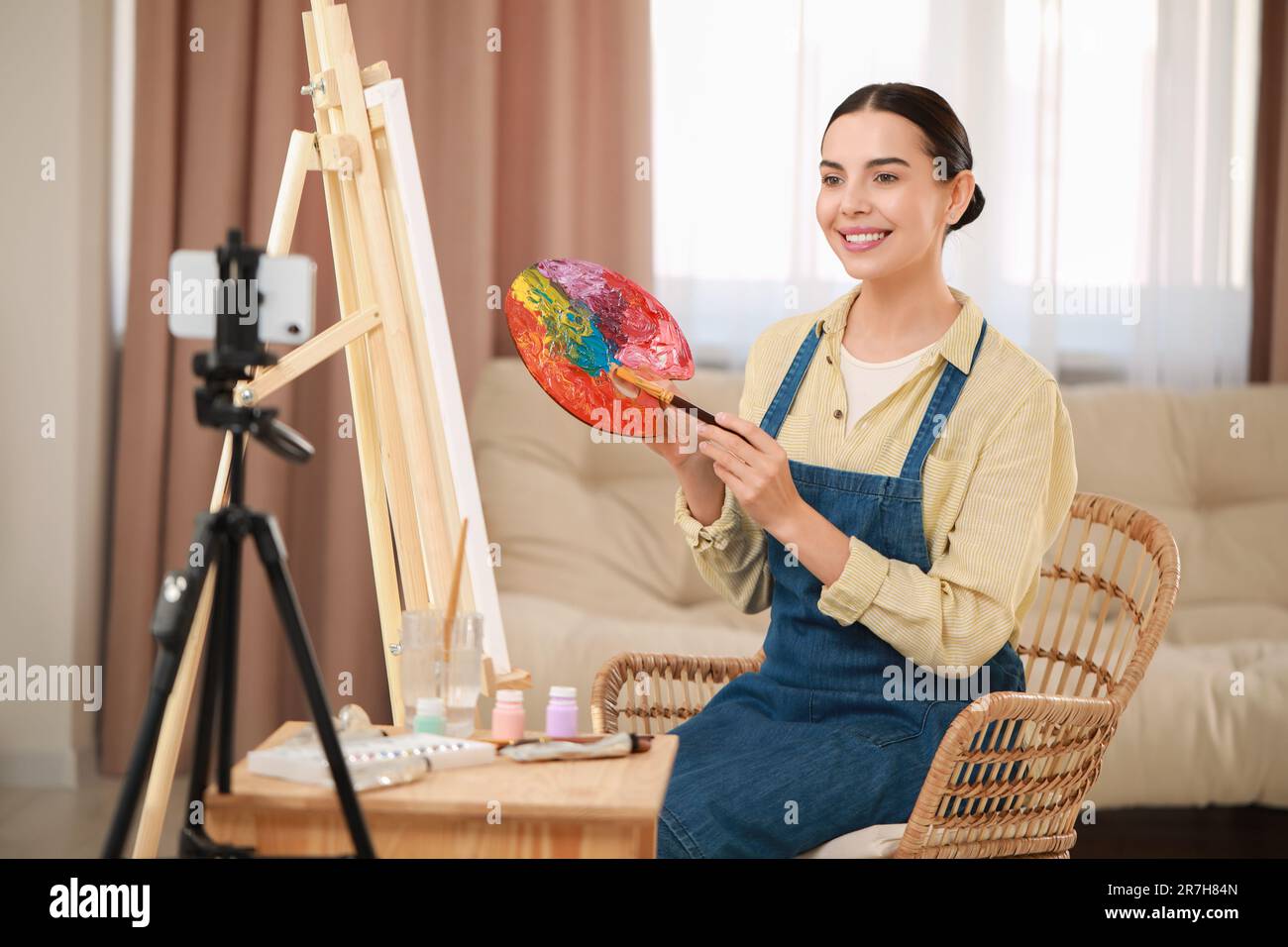 Teacher conducting online painting lesson at home. Time for hobby Stock ...