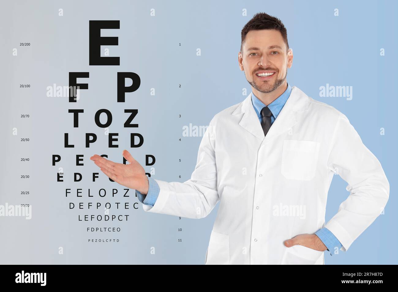 Vision test. Ophthalmologist or optometrist pointing at eye chart on ...