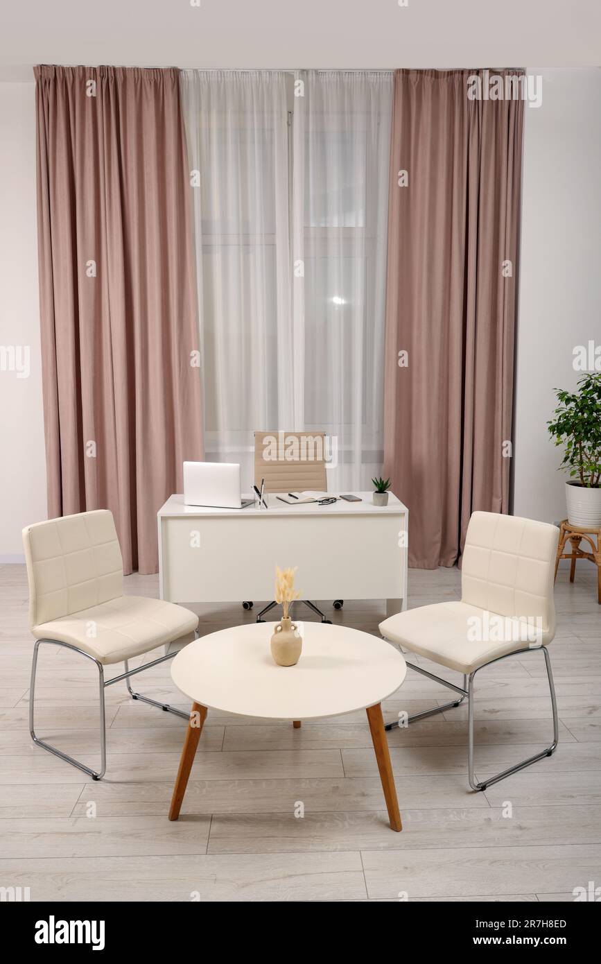 Modern office with comfortable waiting area and reception desk ...