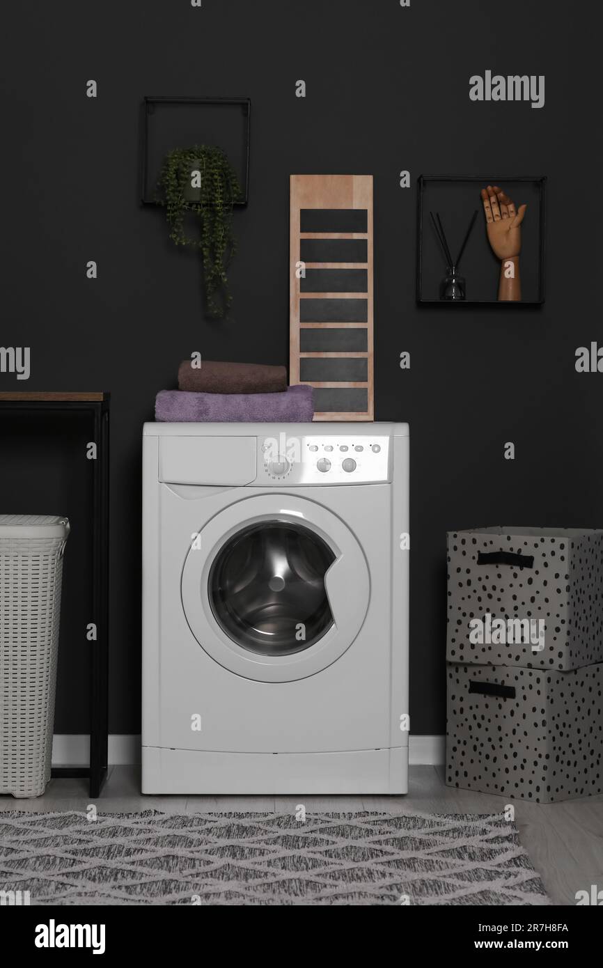 Stylish laundry room with washing machine. Interior design Stock Photo ...