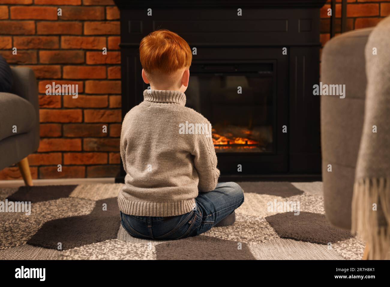 Child siting hi-res stock photography and images - Alamy