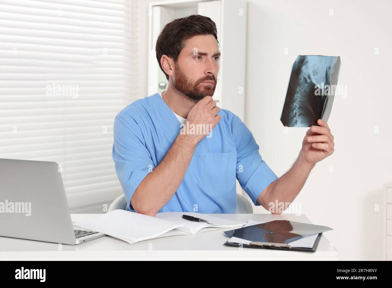 Doctor examining neck MRI scan in hospital Stock Photo - Alamy