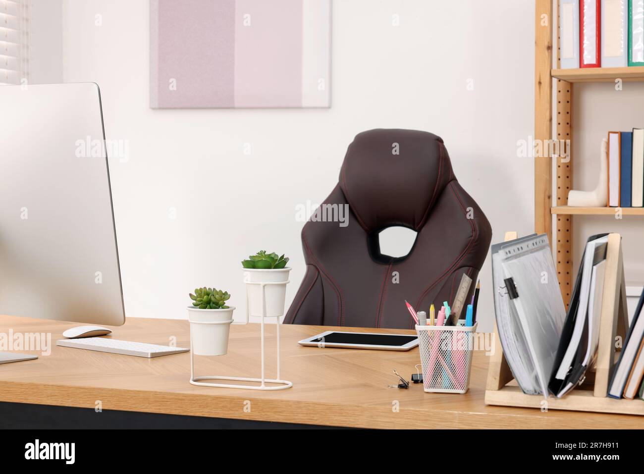 Desk and comfortable chair in modern office. Interior design Stock ...