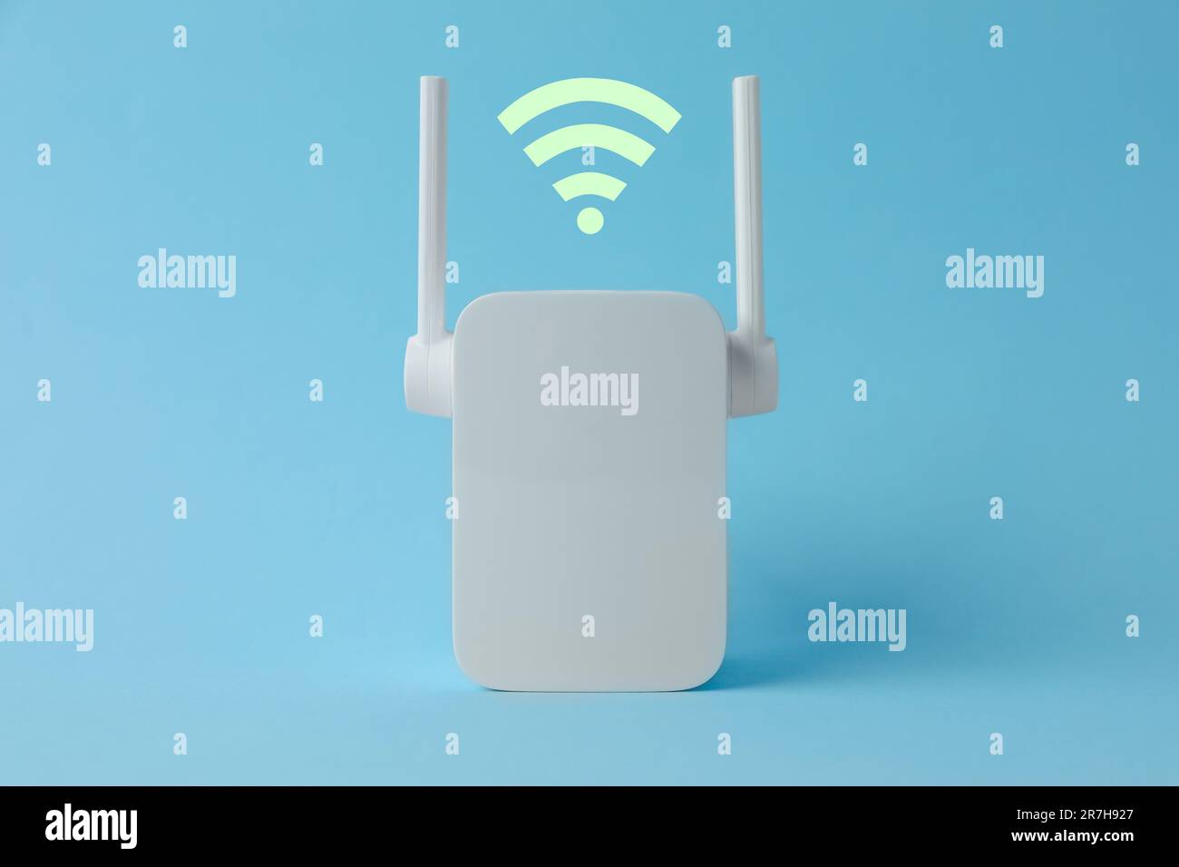 Modern repeater and Wi-Fi symbol on light blue background Stock Photo ...