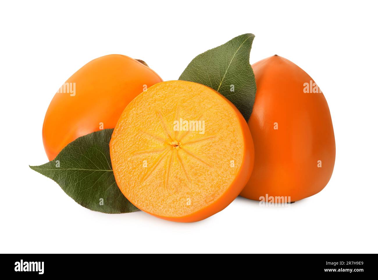 Whole and cut delicious ripe juicy persimmons on white background Stock ...