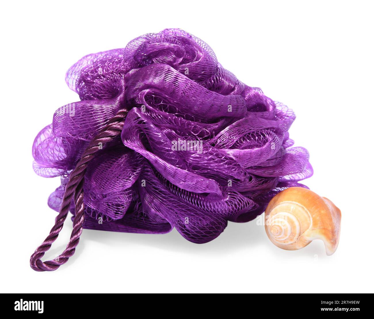 New purple shower puff with seashell on white background. Personal ...