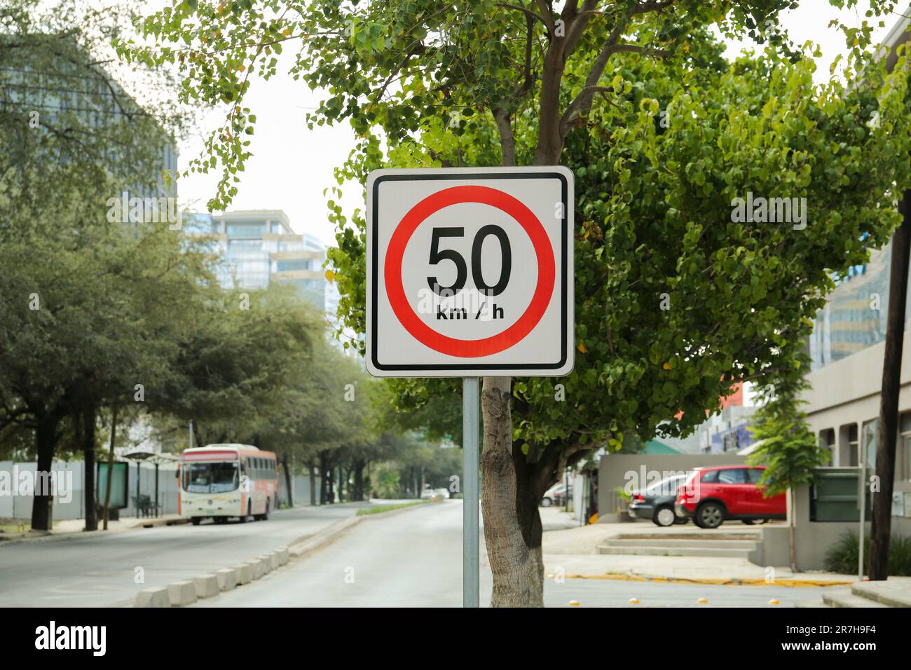 Post with road sign Maximum Speed 50 on city street Stock Photo - Alamy