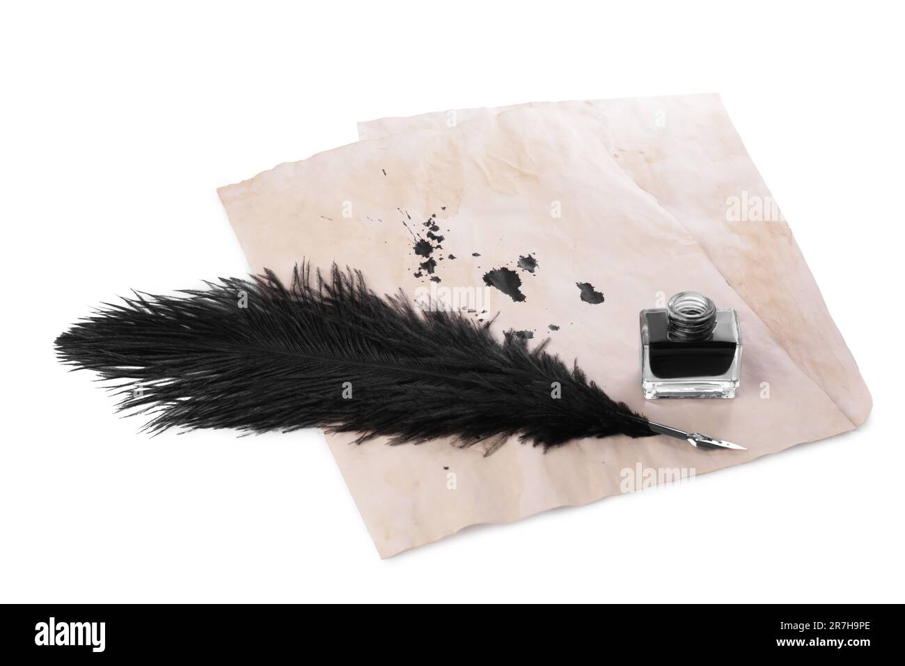 Parchment with stains of ink, feather pen and inkwell on white ...