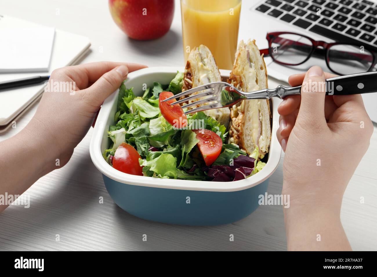 Office employee having business lunch at workplace, closeup Stock Photo ...