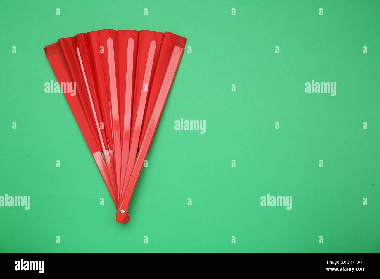 Bright red hand fan on green background, top view. Space for text Stock ... Bright red hand fan on green background, top view. Space for text Stock ...