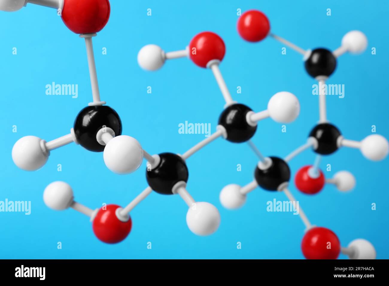 Molecule of glucose on light blue background, closeup. Chemical model ...