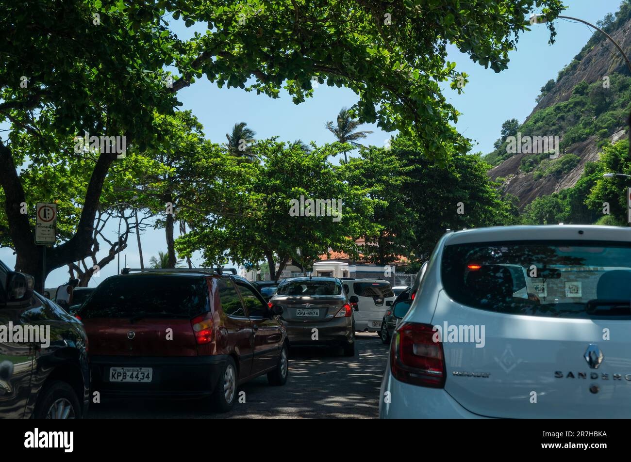 Cars stopped in a traffic jam at General Tiburcio square with green ...