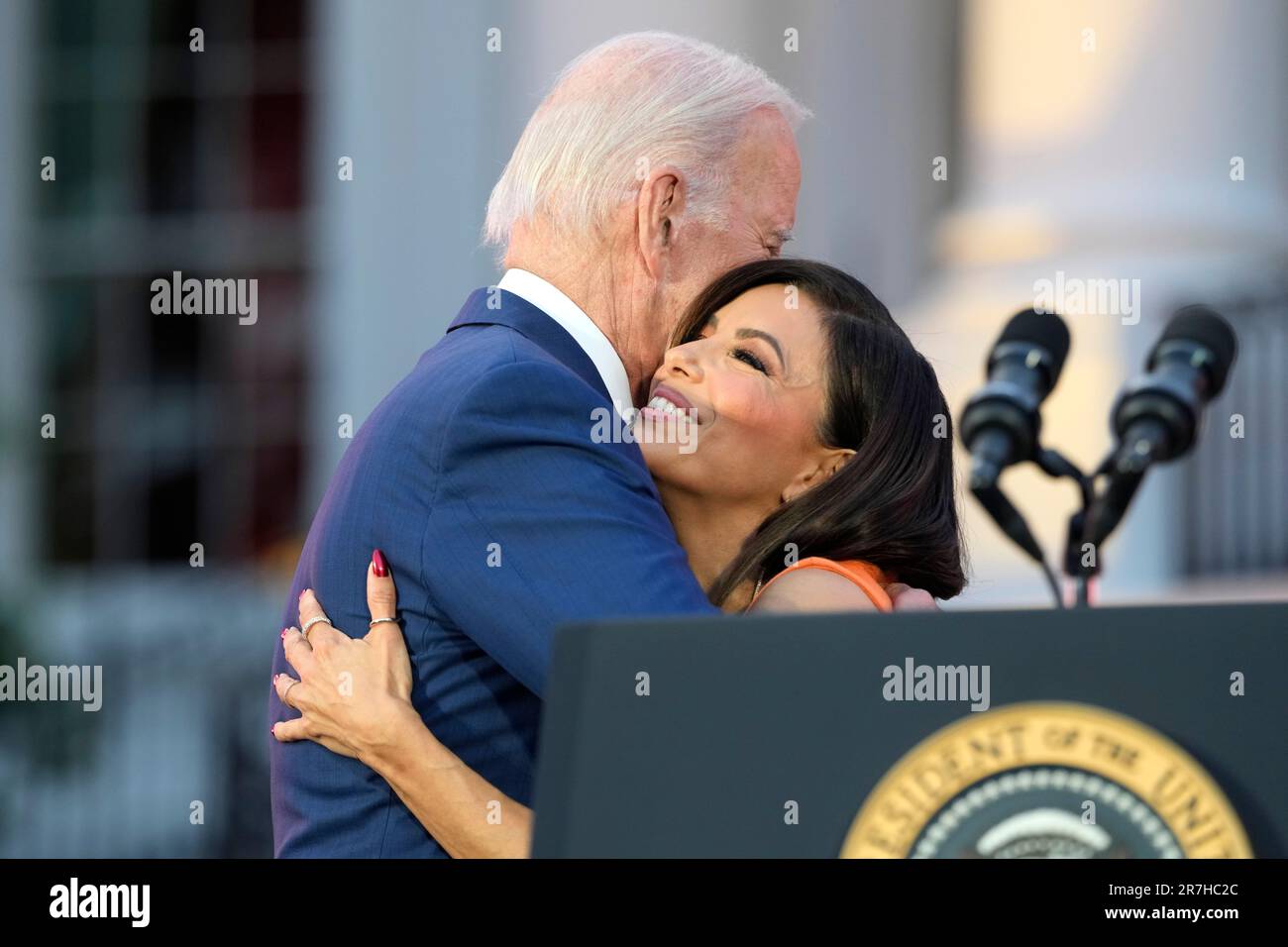 President Joe Biden hugs Eva Longoria before a screening of the film ...