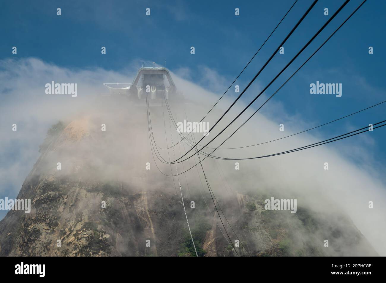 The Sugarloaf mountain in Urca district engulfed by passing clouds with ...