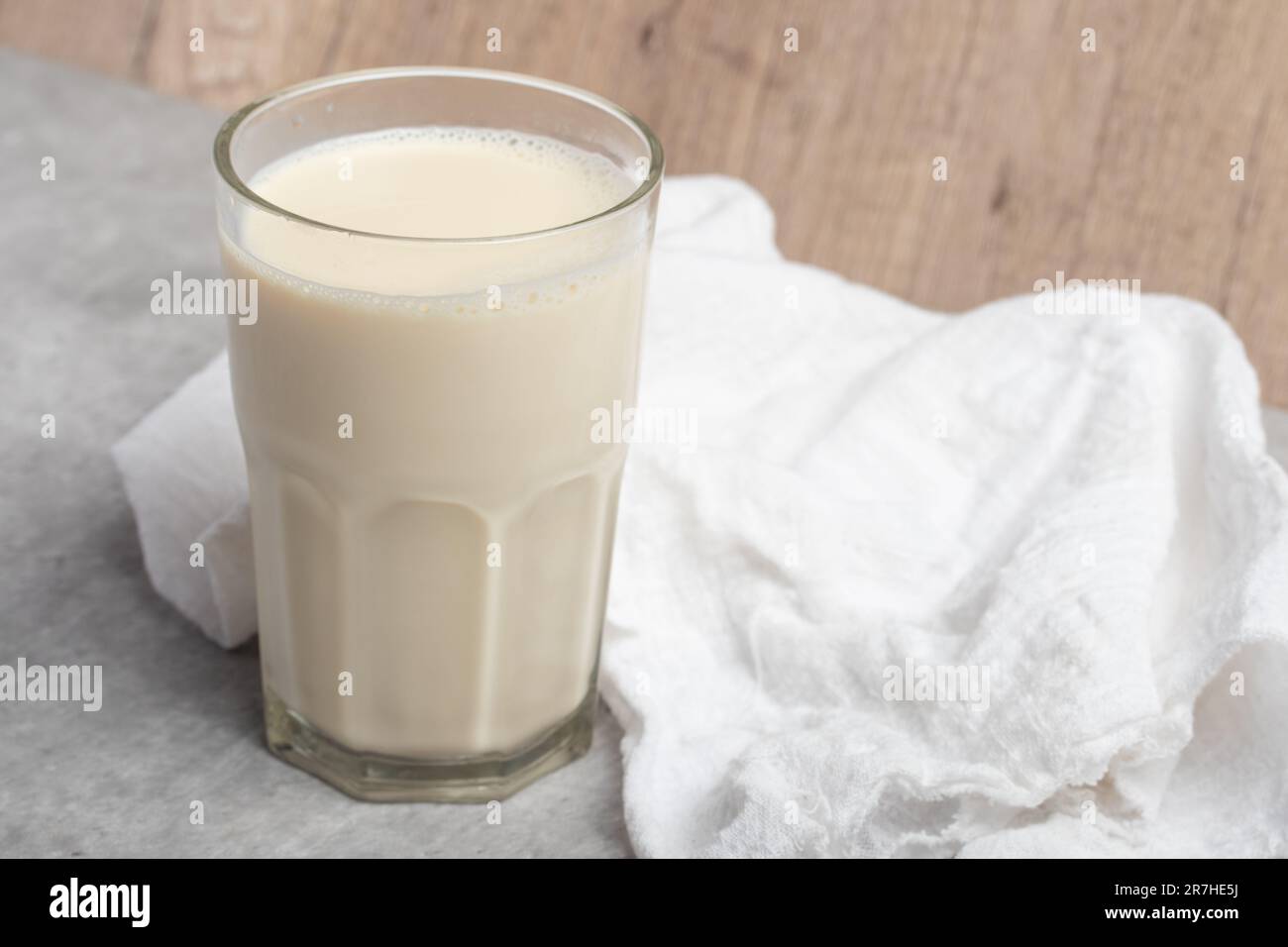 Hot fresh milk in transparent glass on gray background Stock Photo - Alamy