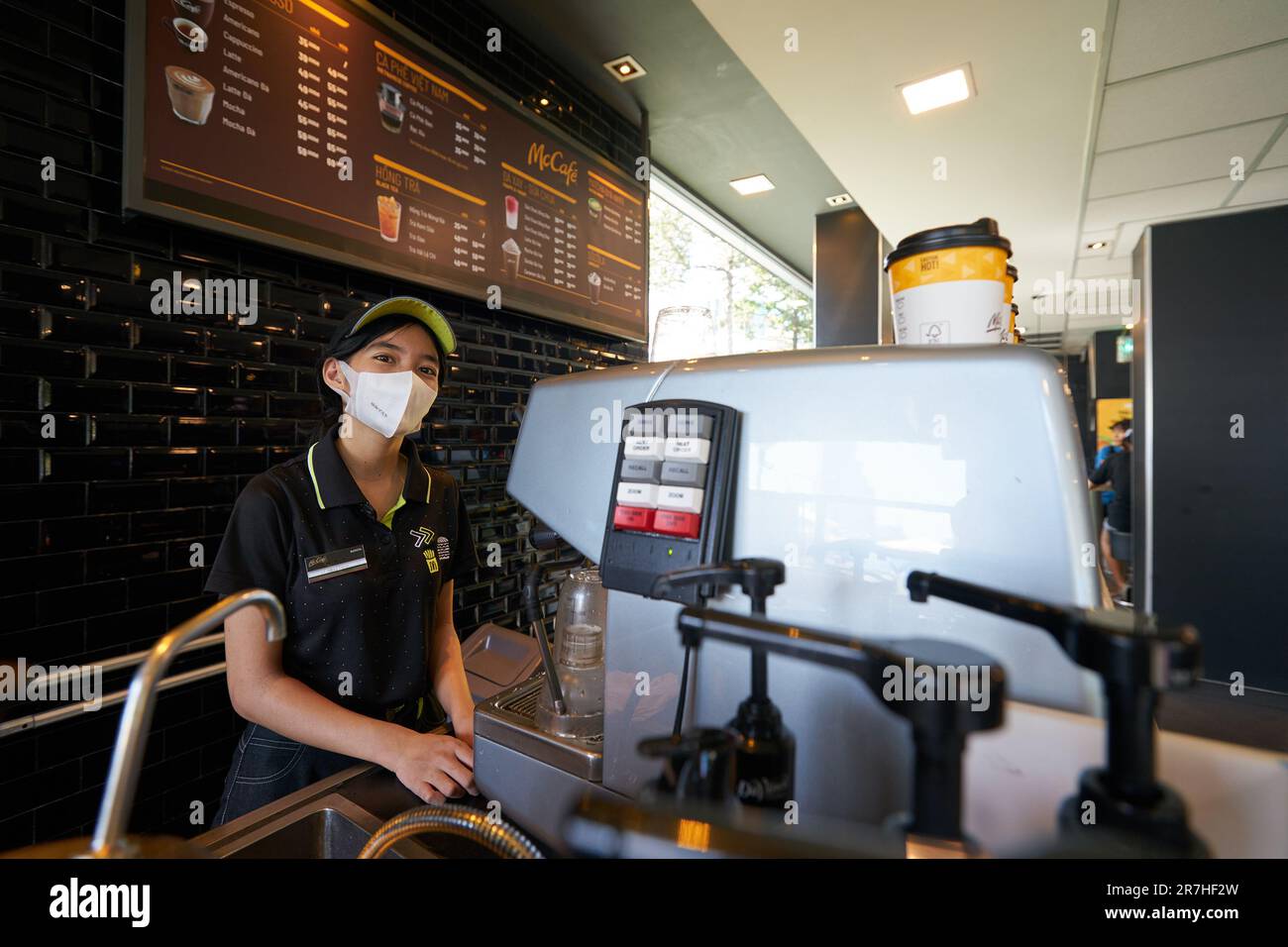 HO CHI MINH CITY, VIETNAM - CIRCA MARCH, 2023: barista posing at McCafe ...